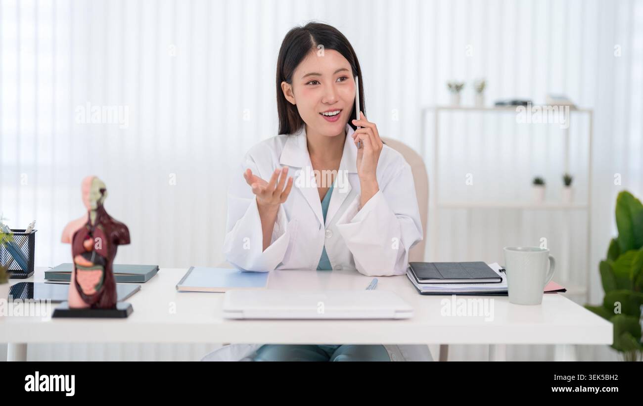 Asian women doctor talking phone consultation medical professional ...