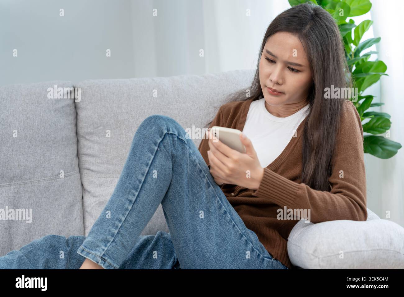 Unhappy asian woman girl disappointed, sad about problem in home alone ...