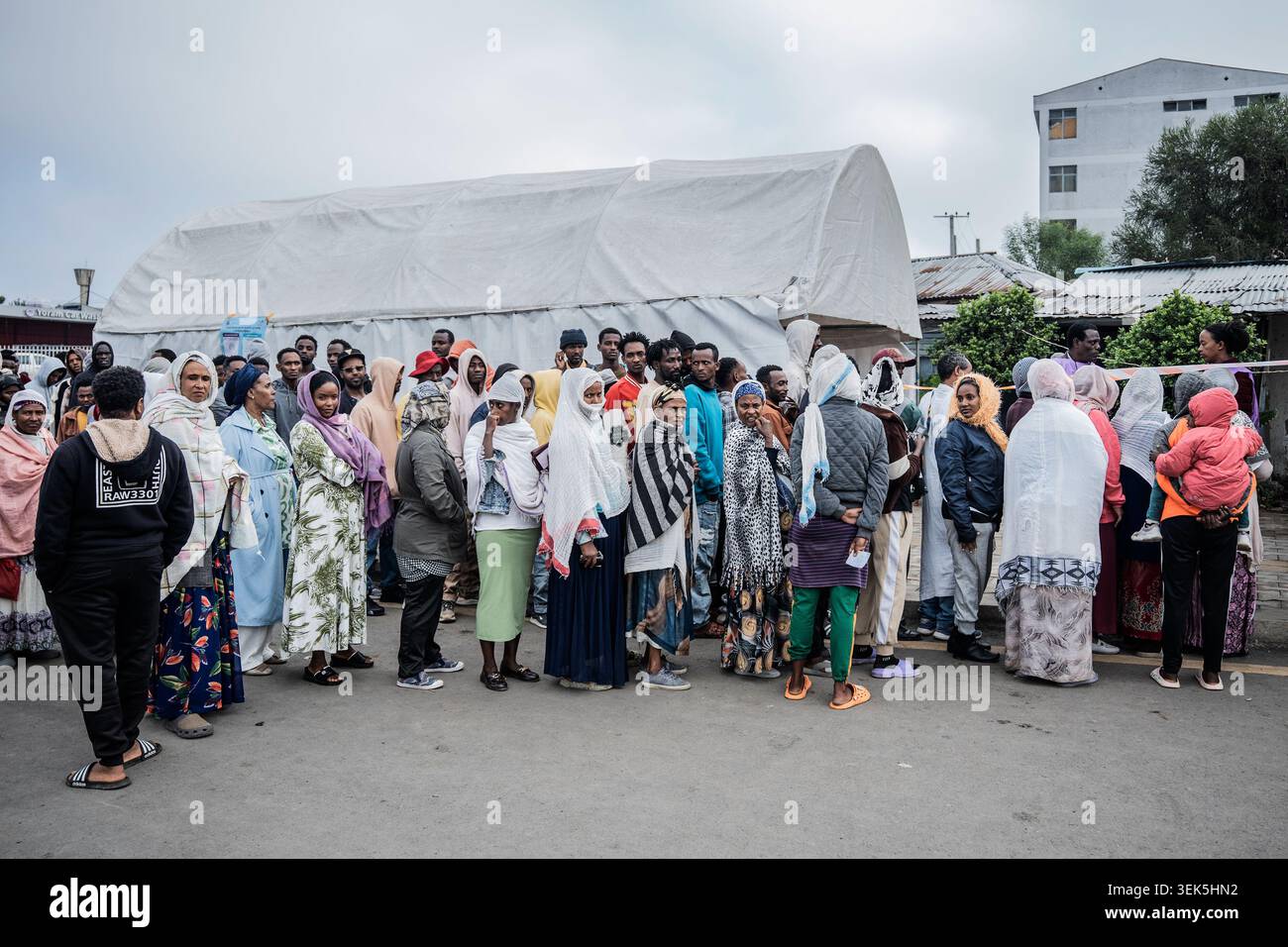 Ethiopian voters gather outside a polling station during the general ...