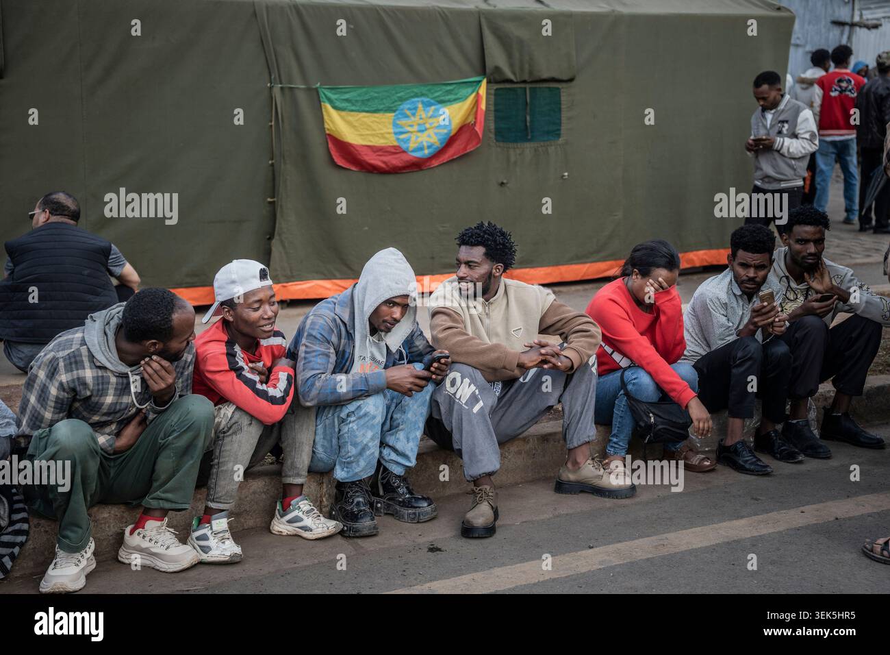 Ethiopian voters wait outside a polling station before voting begins in ...