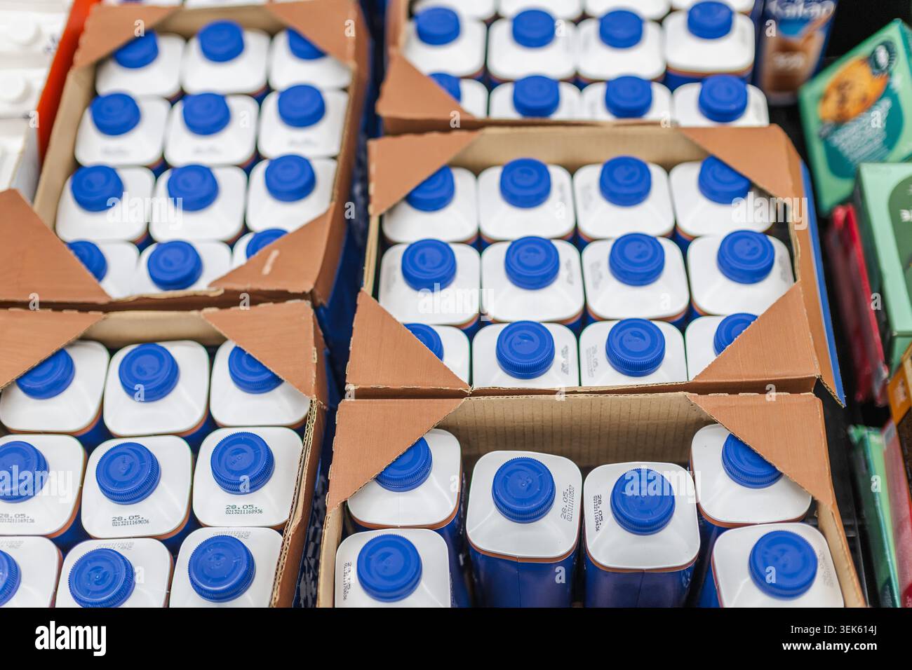 Cartons with milk packages displayed in grocery store from top view ...