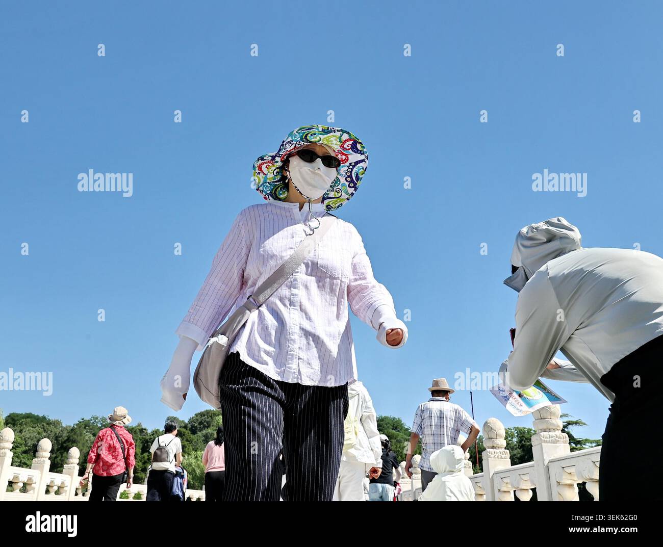 Tourists visit Beihai Park under scorching sun in Beijing, capital of ...