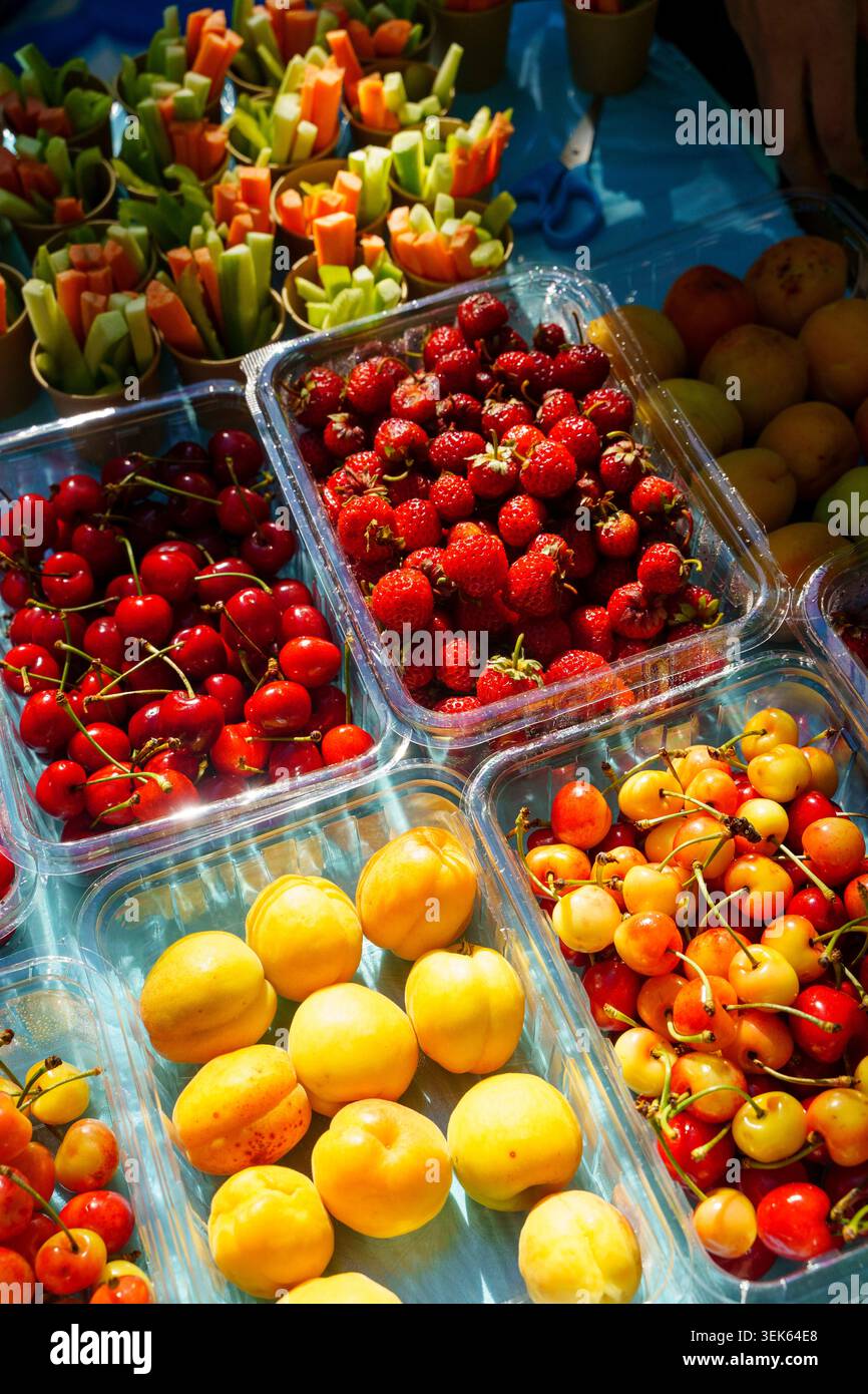 Assortment of fresh summer fruits and vegetable snacks for a picnic ...