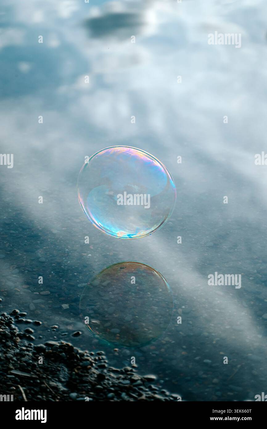 Minimalist Soap Bubble Floating Above Calm Lake Water Symbolizing ...