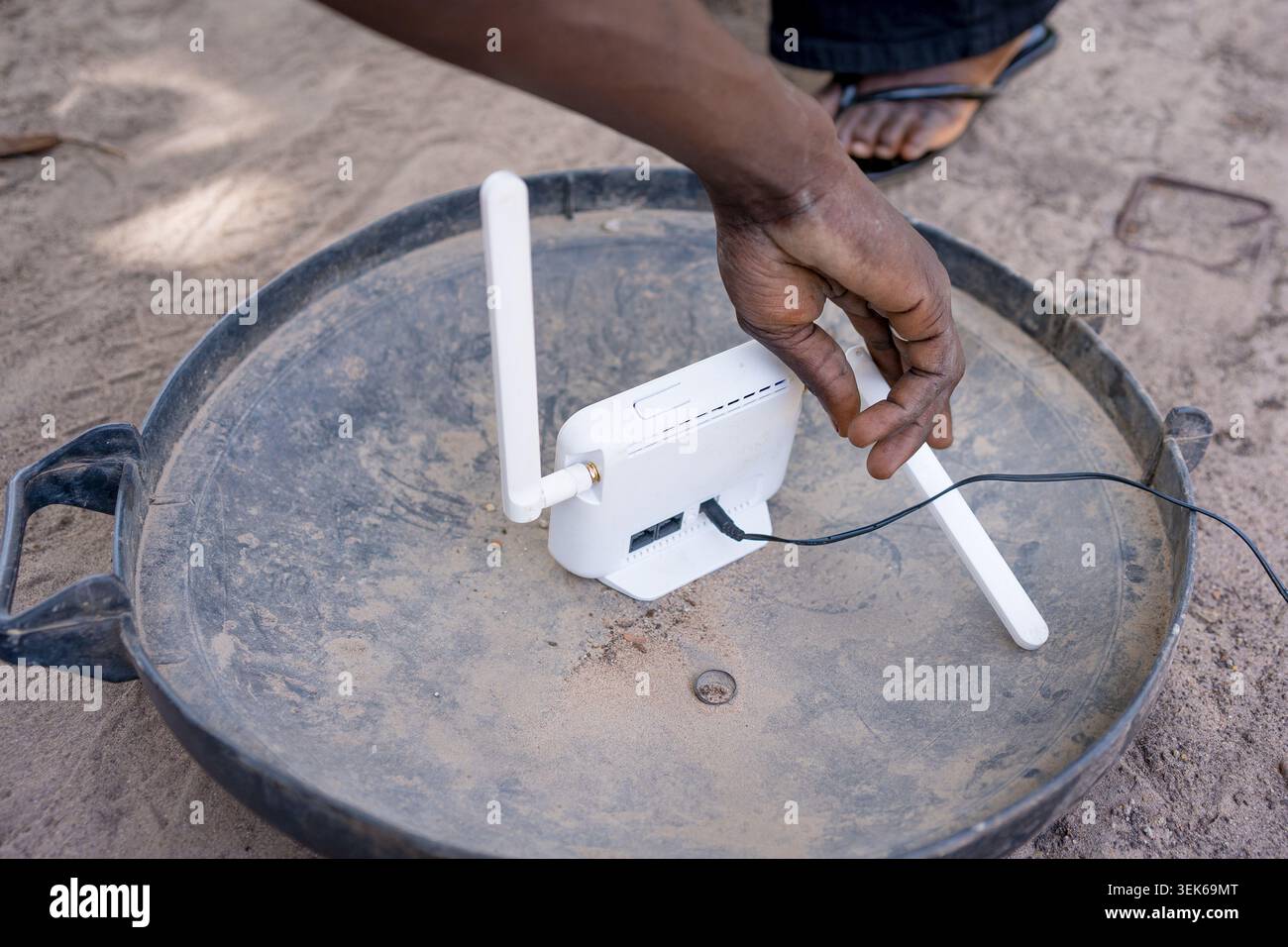Internet router seen in black african person hands, concept of ...