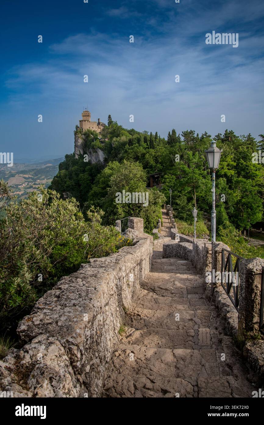 Scenic stone pathway leading towards ancient fortress ruins atop a ...