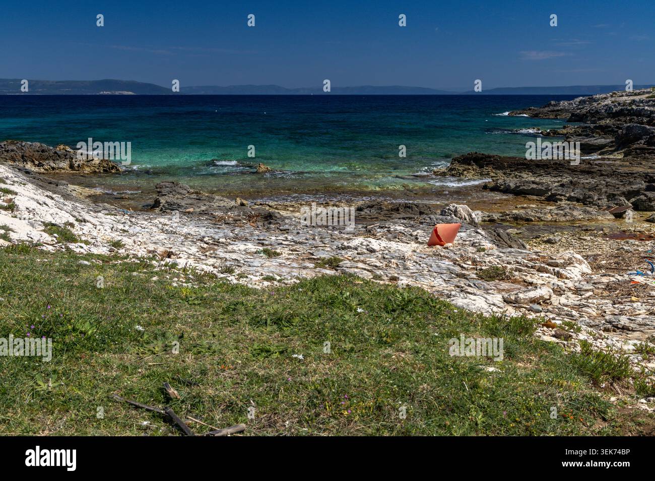 Waste and debris scattered along the Adriatic coastline near Ližnjan in ...