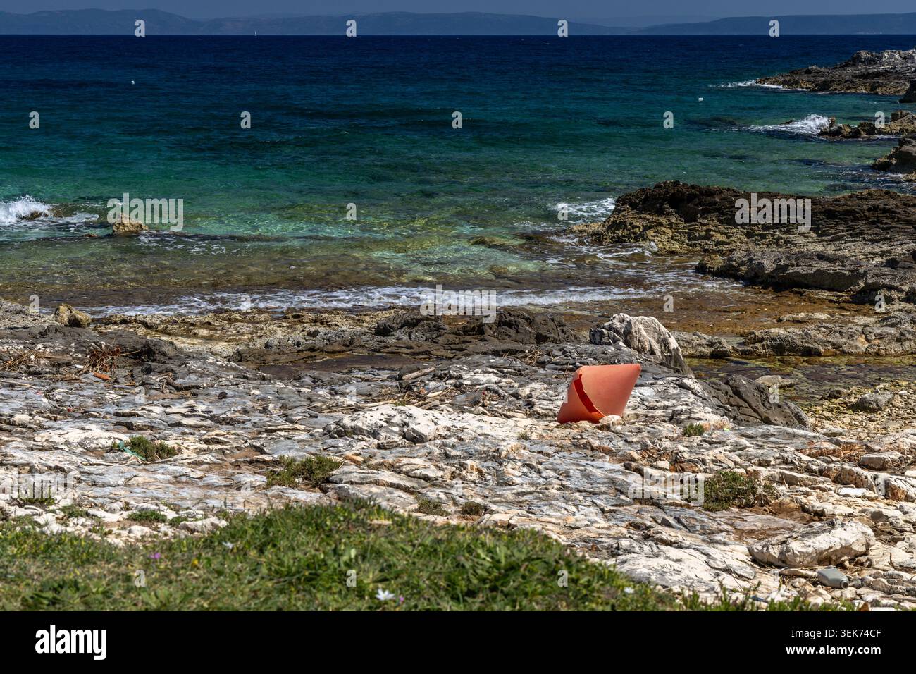 Waste and debris scattered along the Adriatic coastline near Ližnjan in ...