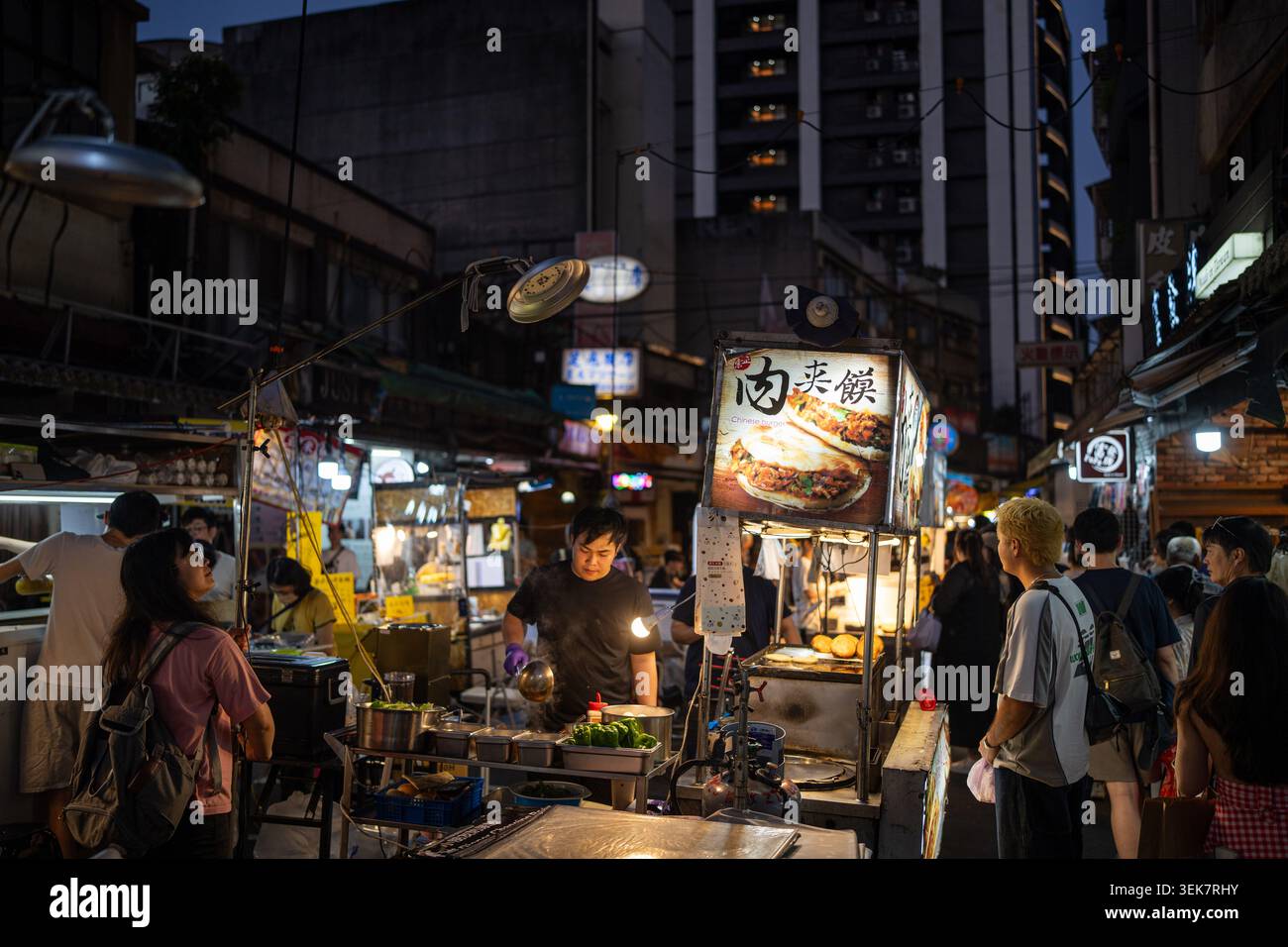 A shopkeeper at a night market in Taipei, Taiwan, June 1, 2026. NEXPHER ...