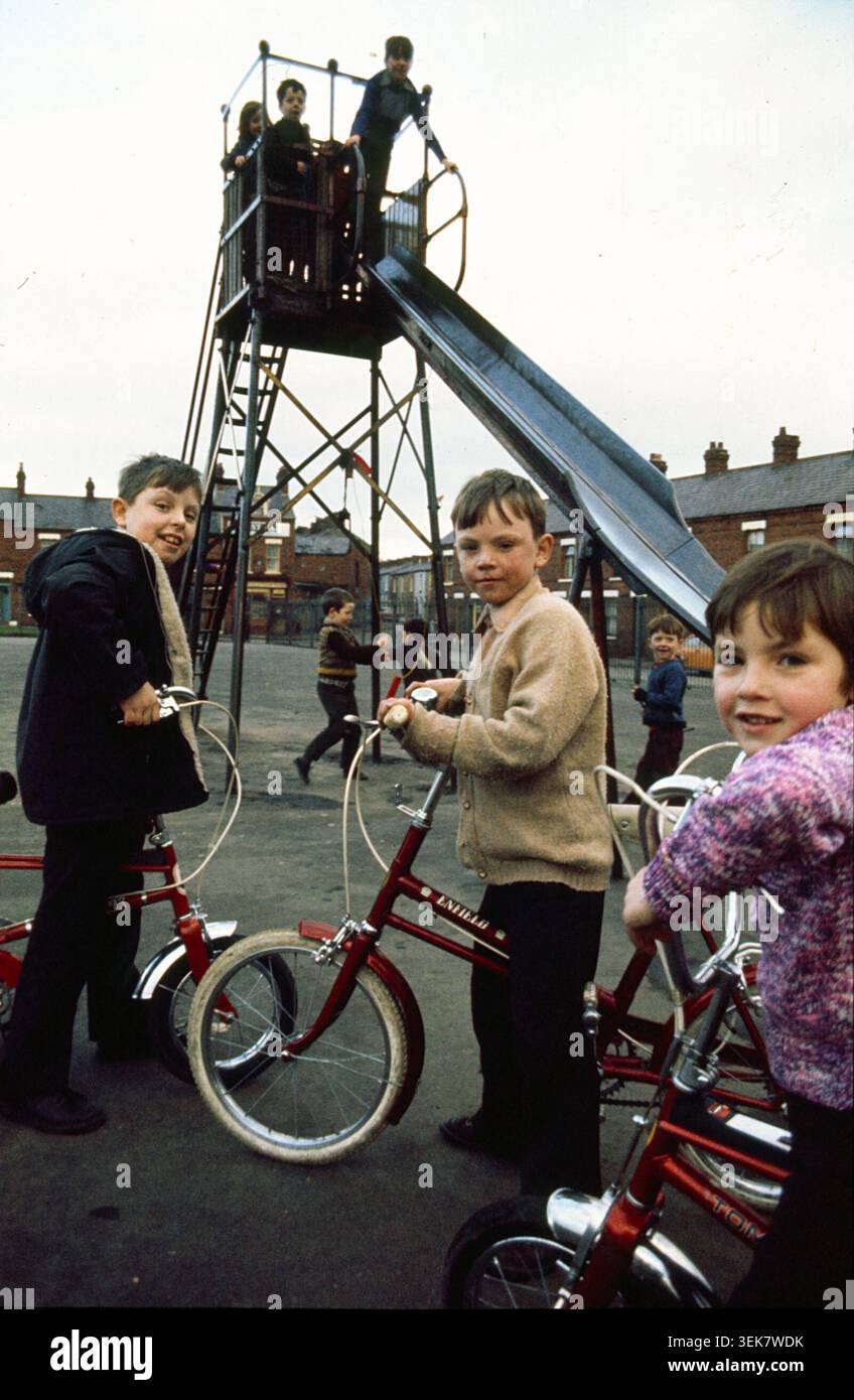 File - Children play in the ruined Catholic quarter of Falls Road in ...