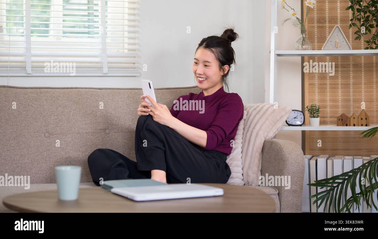 Asian women using smartphone for video call telemedicine consultation ...