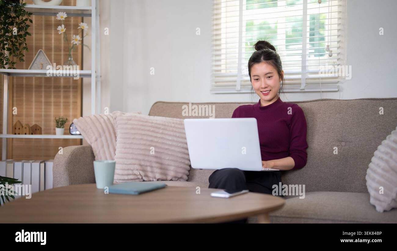Asian women professional using laptop computer working from home ...
