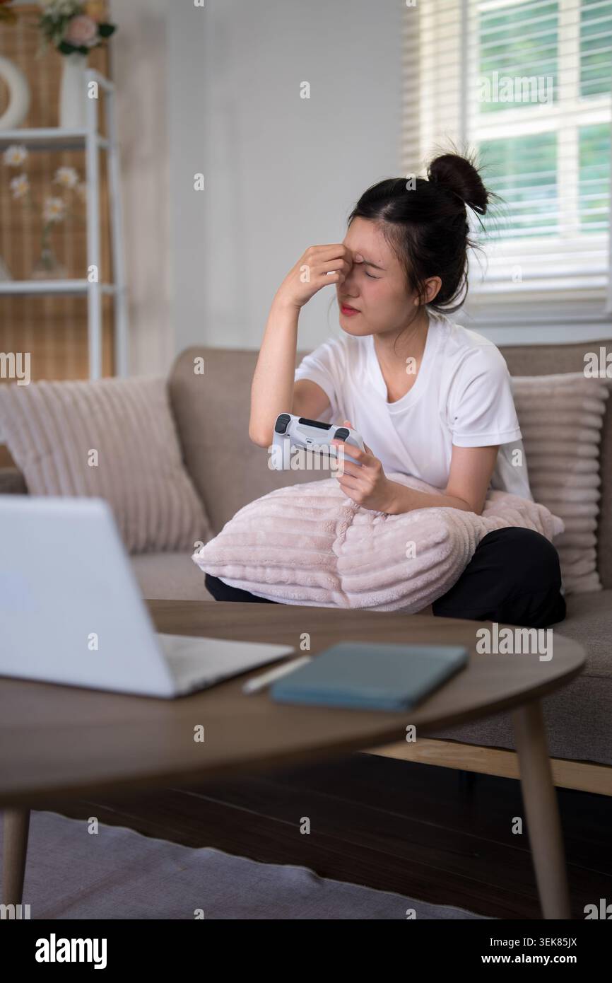 Asian young women suffering headache tired exhausted stress holding ...