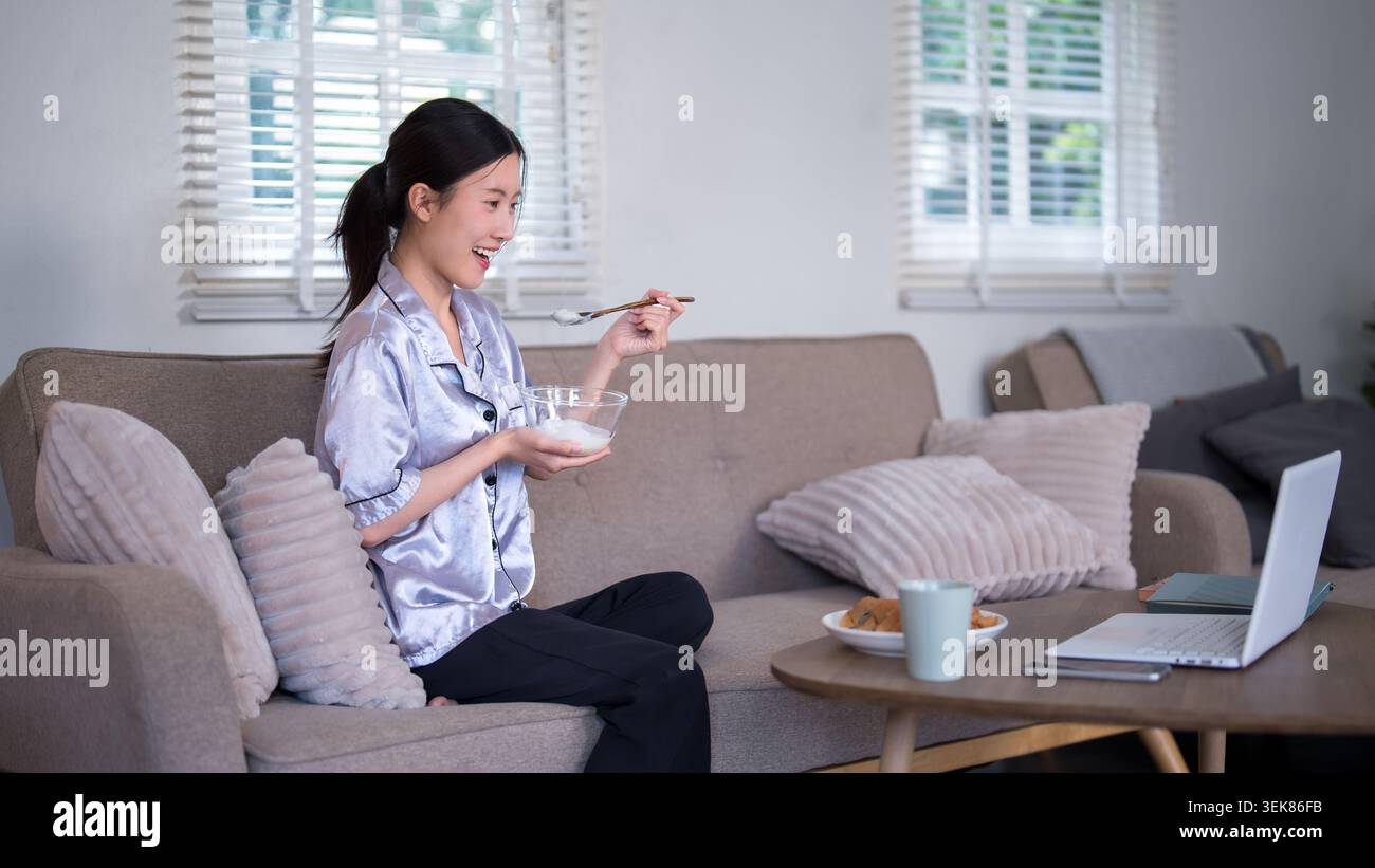 Asian women doctor eating healthy breakfast with chopsticks while ...