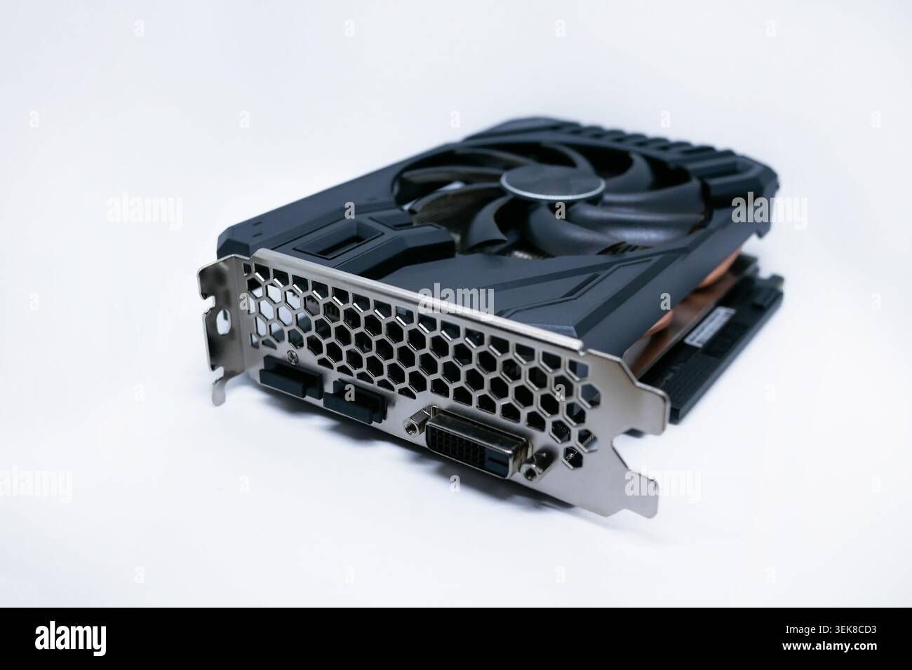 Modern graphics card with fan cooler on white background. Computer ...