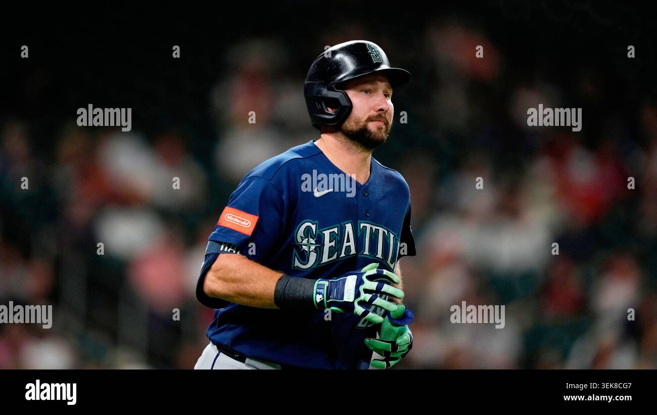 Seattle Mariners' Cal Raleigh runs up the first base line during a ...
