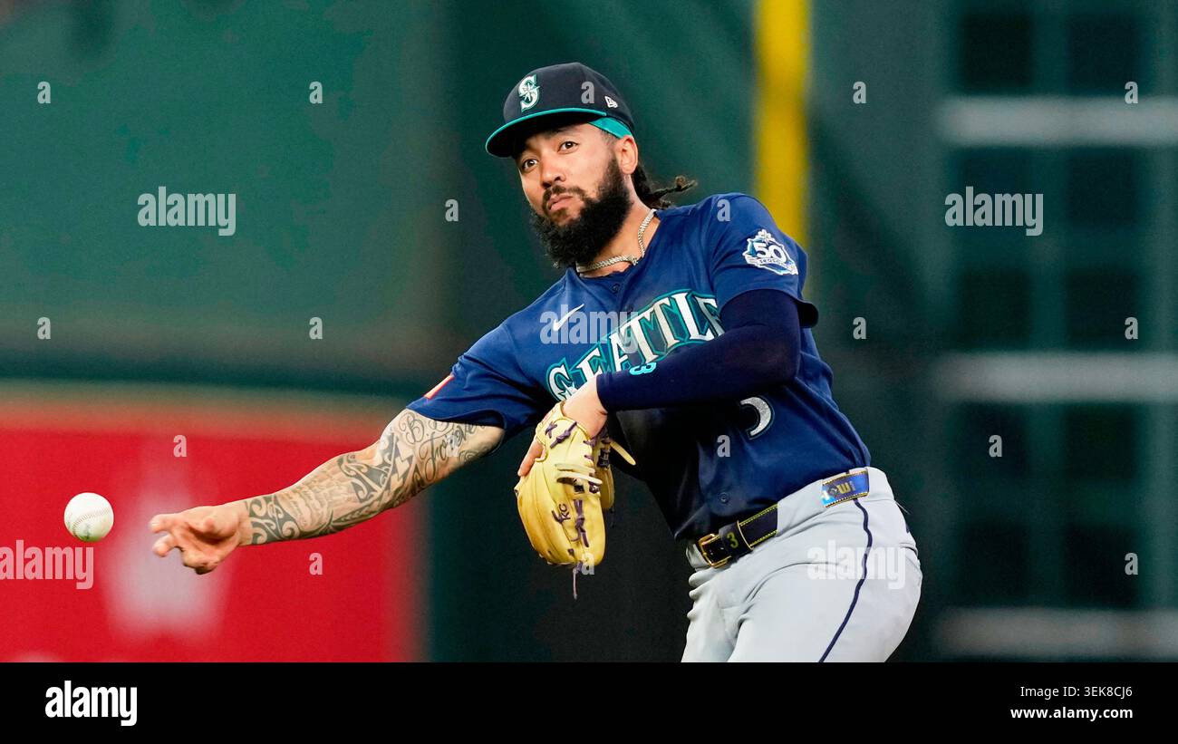 Seattle Mariners' J.P. Crawford throws to first during a baseball game ...