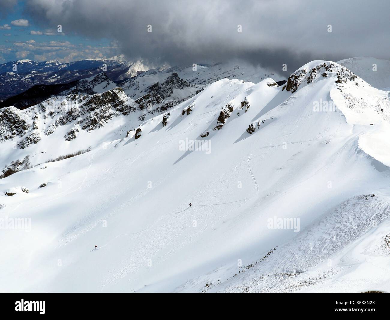 Backcountry skiers descending the slopes of Monte Aquila. MONTE AQUILA ...