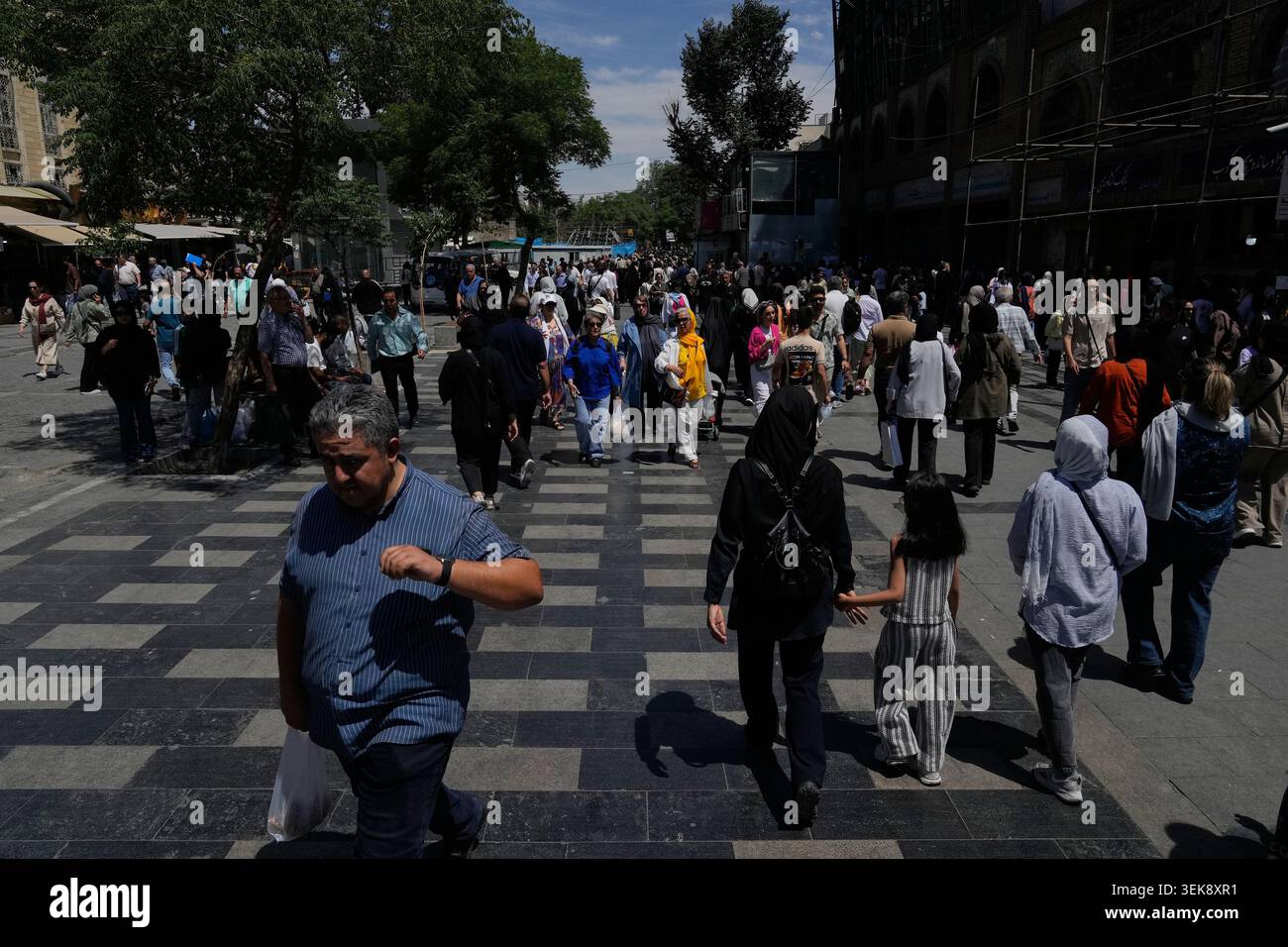 People walk around Tehran's historic Grand Bazaar, Iran, Monday, June 1 ...