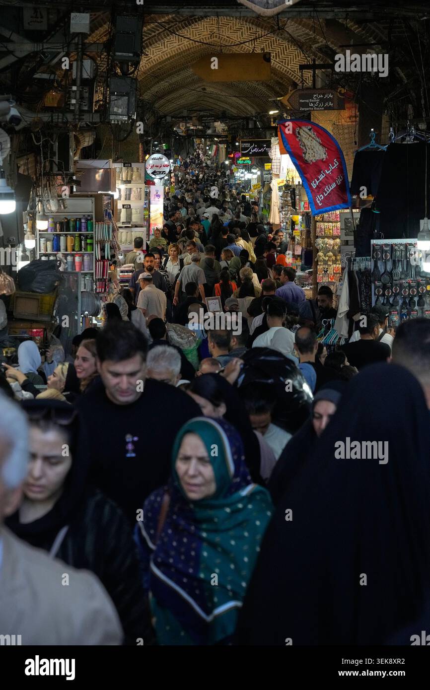 People walk at Tehran's historic Grand Bazaar, Iran, Monday, June 1 ...