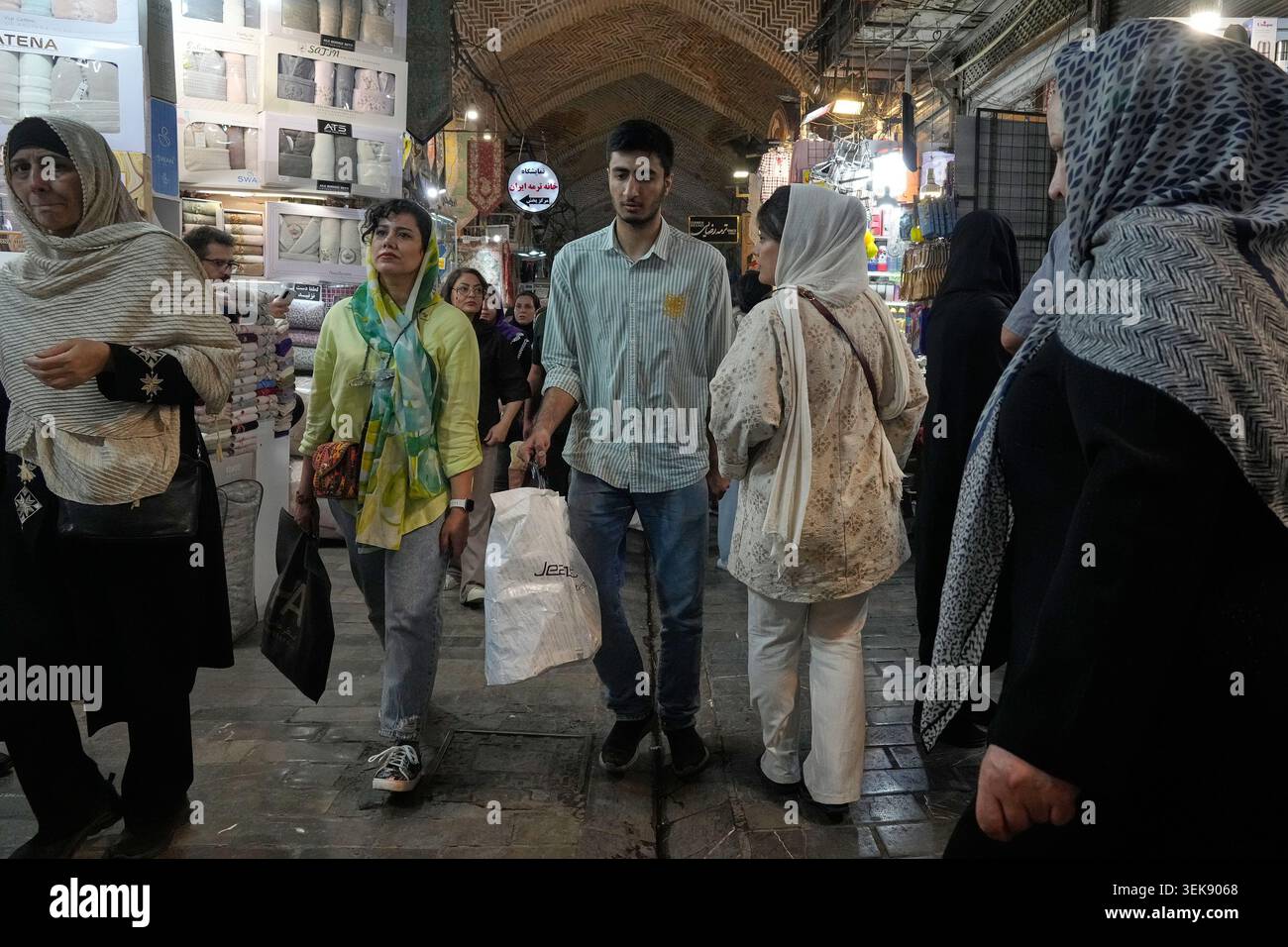 People walk at Tehran's historic Grand Bazaar, Iran, Monday, June 1 ...