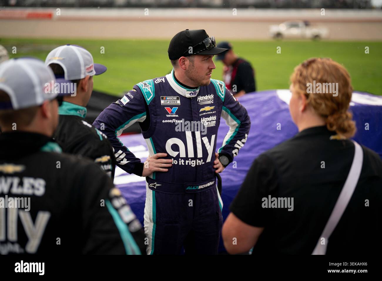 Alex Bowman, center, stands with his team before a NASCAR Cup Series ...