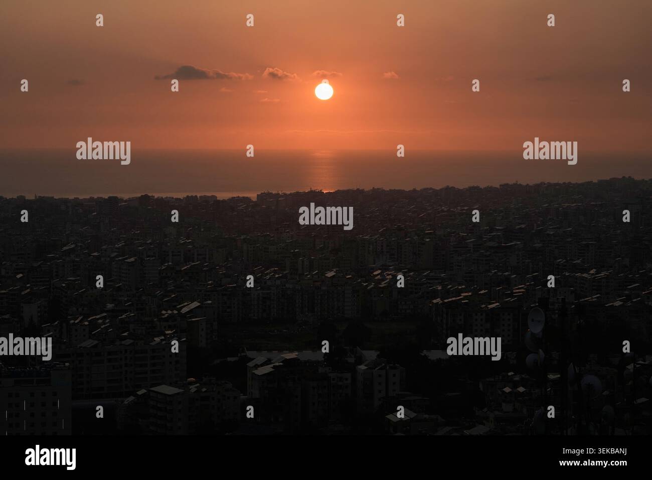 The sun sets over Dahiyeh, Beirut's southern suburbs, following an ...