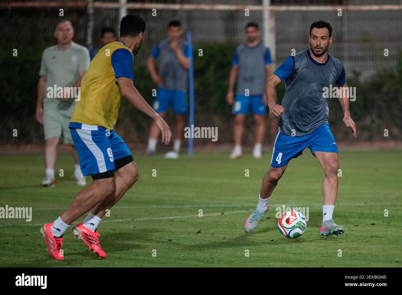 Iran's Shojae Khalilzadeh, right, plays the ball next to teammate Mehdi ...