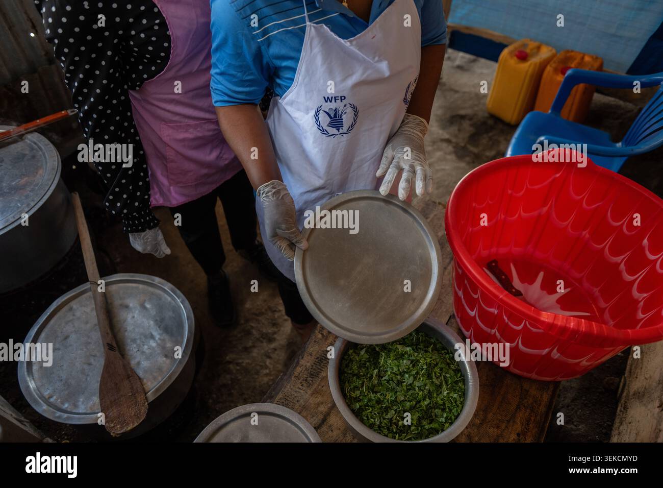 Cooks prepare meals for Ebola patients at the Evangelical Medical ...