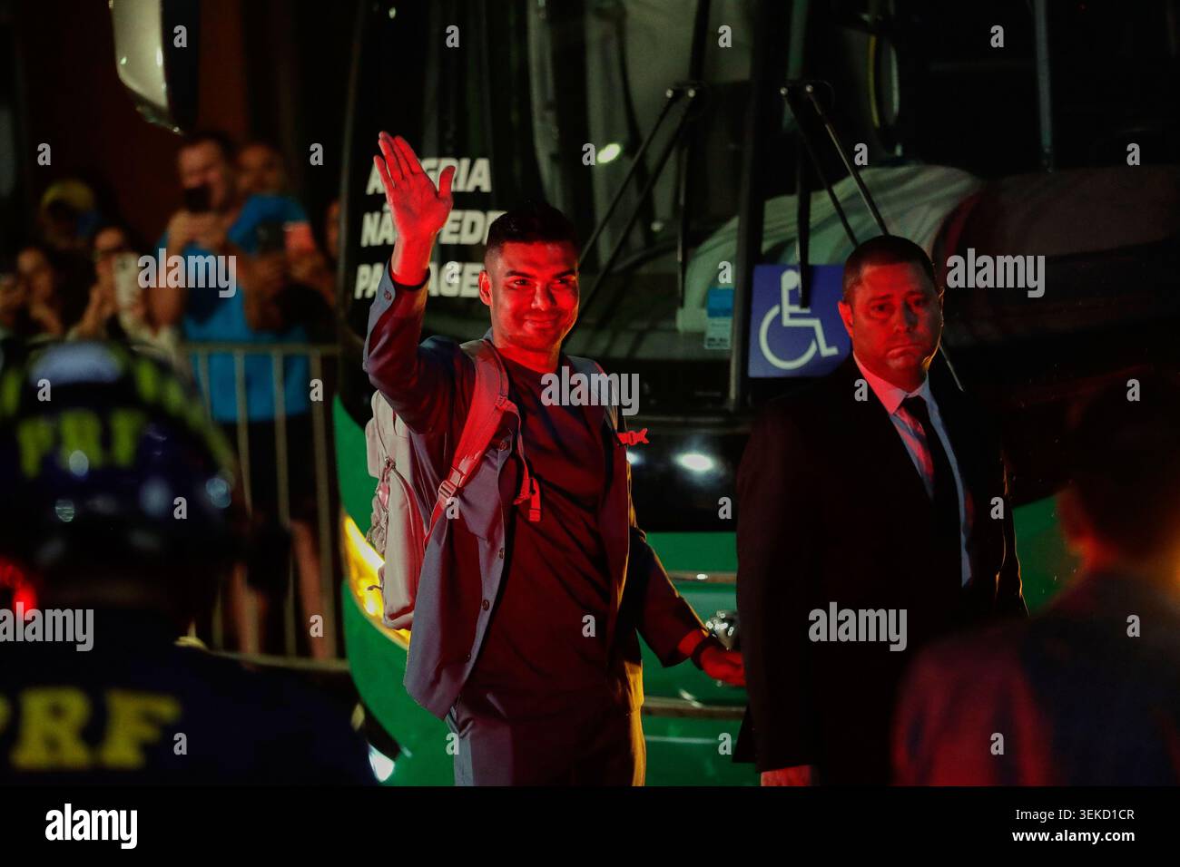 Brazil's Casemiro waves while boarding a bus to the airport ahead of ...