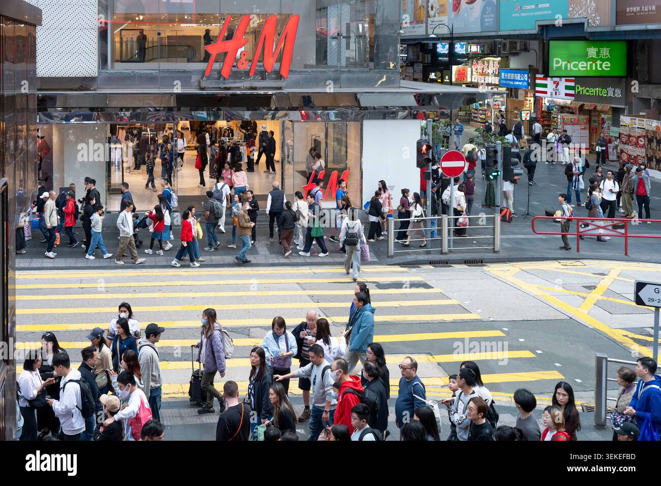 People wait at a traffic light in front of the Swedish multinational ...