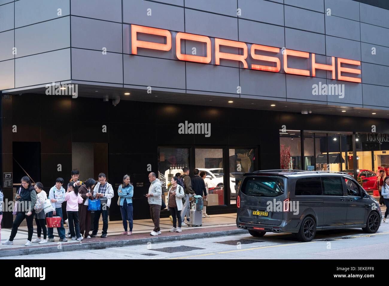 Pedestrians seen outside a dealership showroom of the German luxury car ...