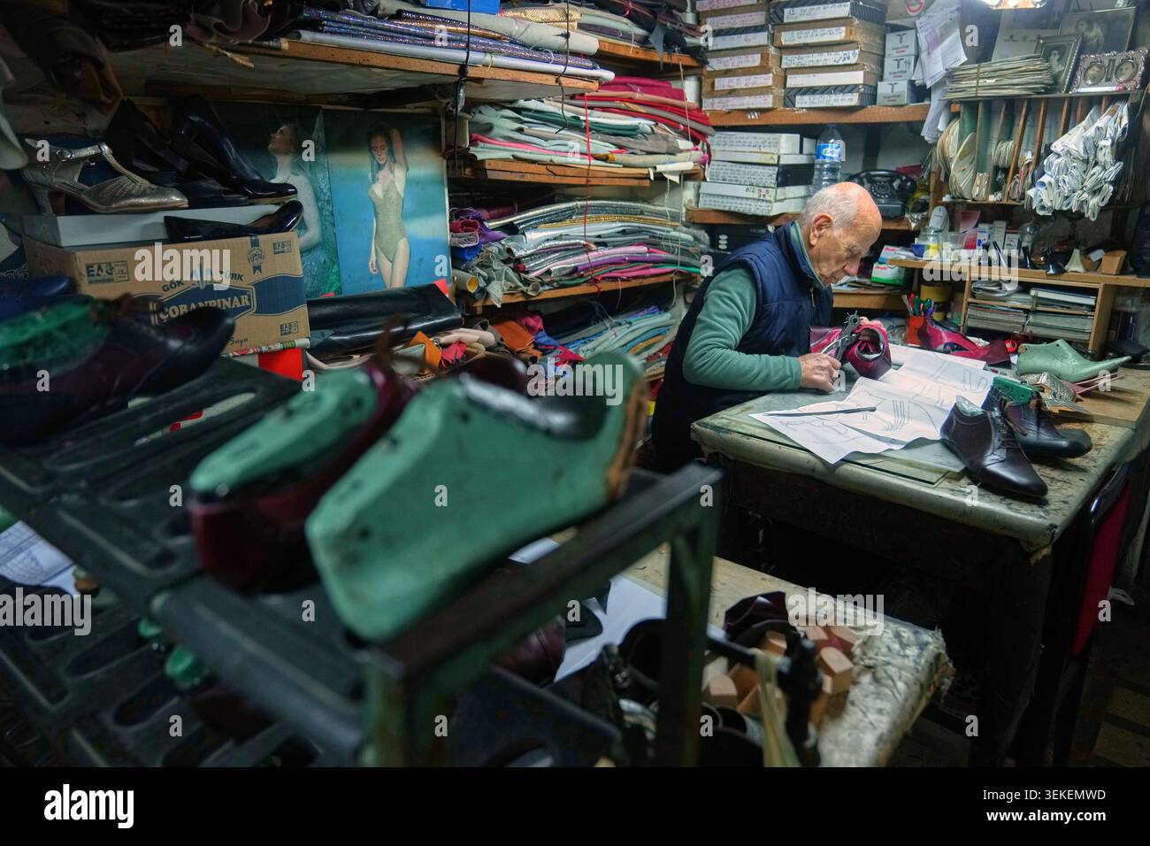 Dance shoe craftsman Ercan Umay works at his workshop in Istanbul ...