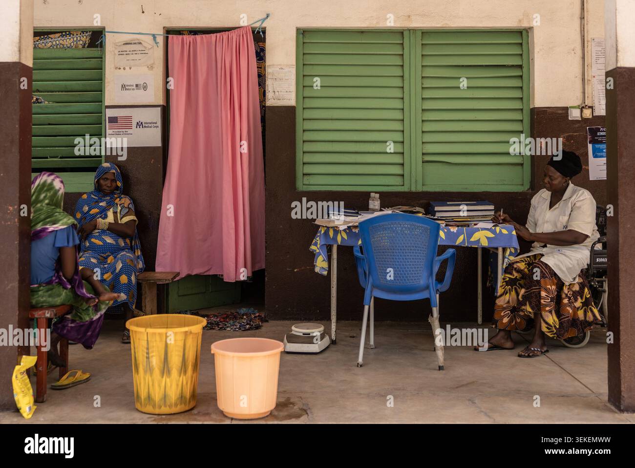 Women wait outside the delivery room at the Birao District Hospital in ...