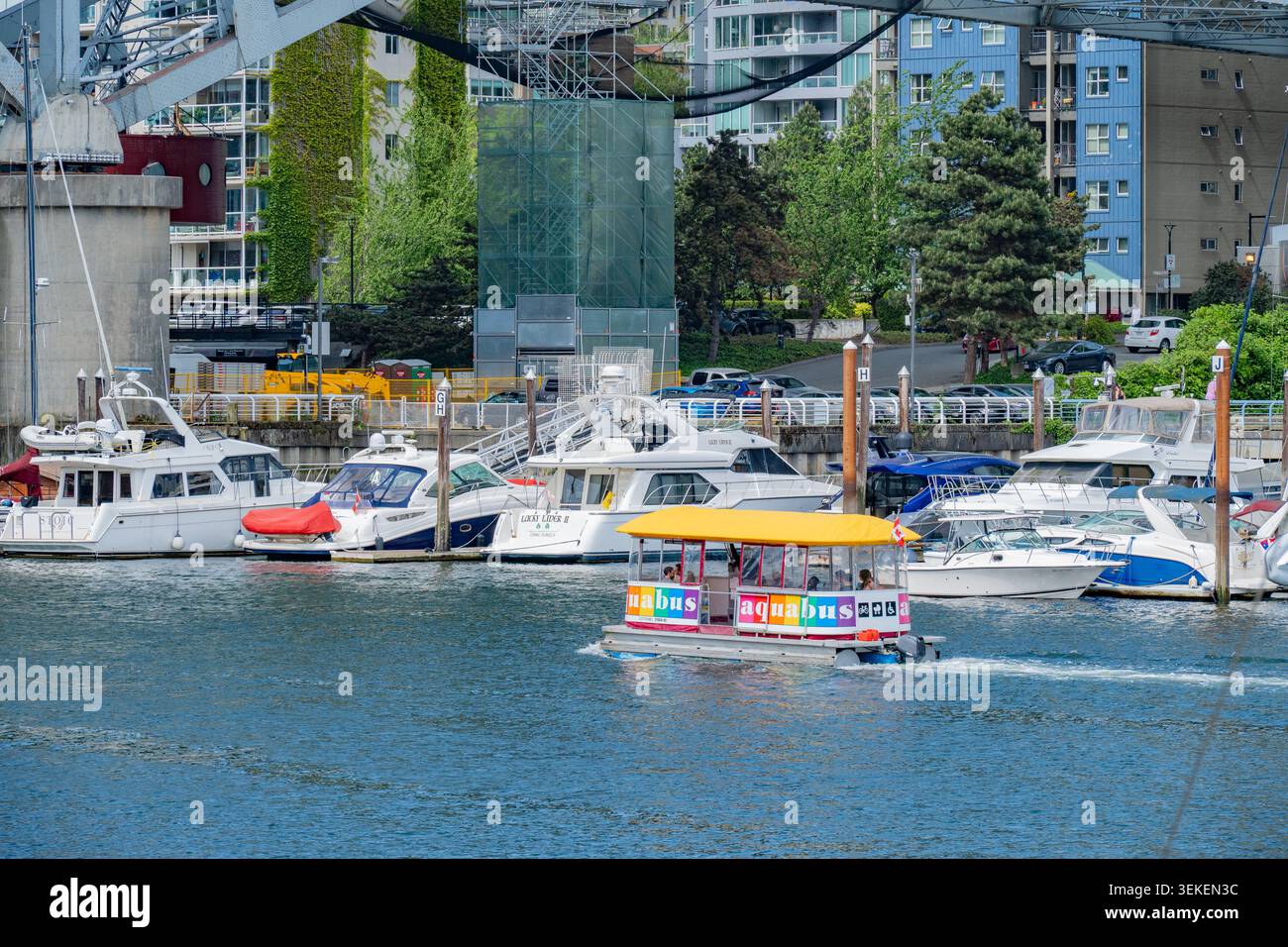 Colorful Aqua bus Ferry in False Creek Stock Photo - Alamy