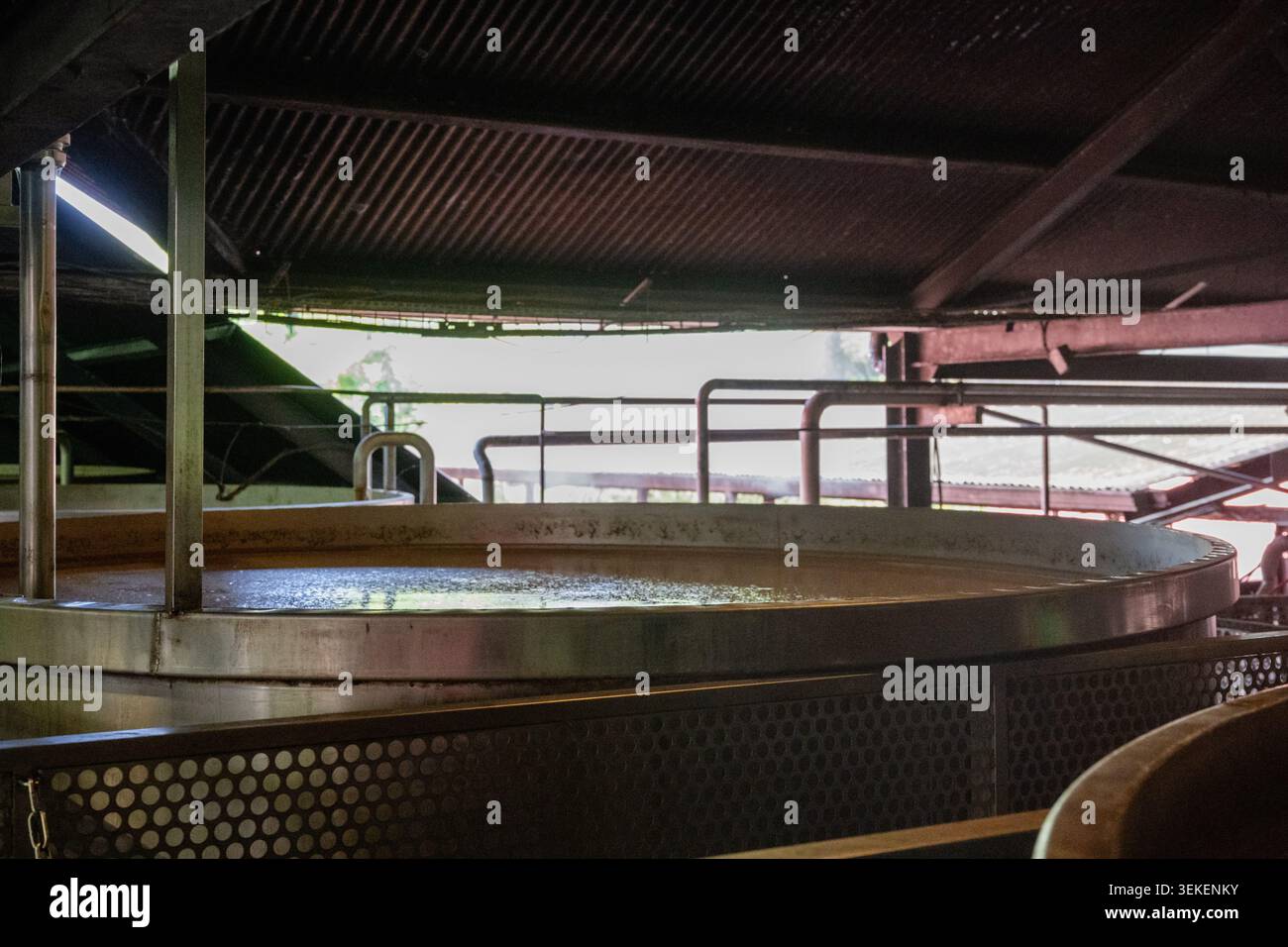 Large open tank showcasing an industrial setup in a natural environment ...