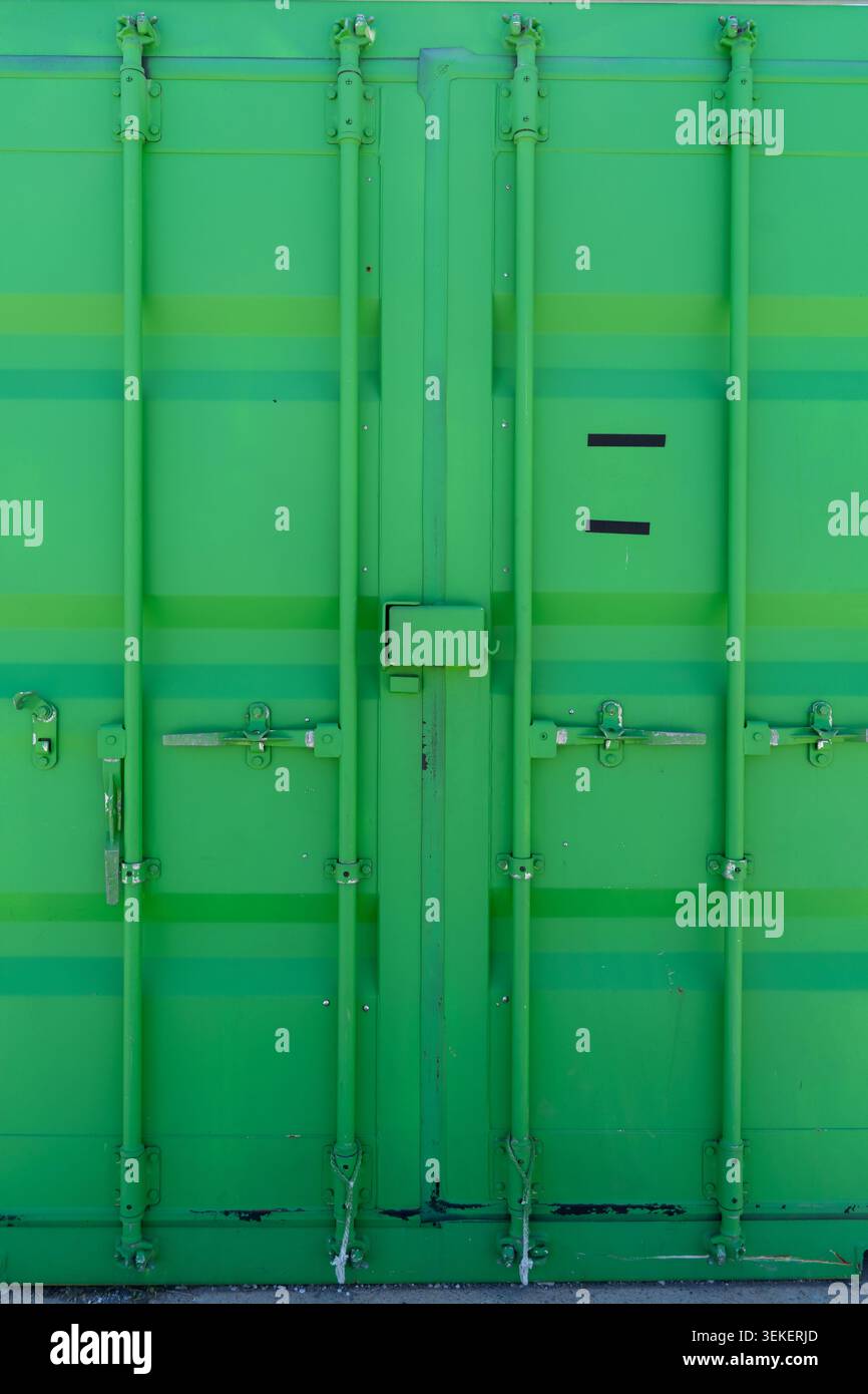 A close up view of a bright green shipping container door featuring ...