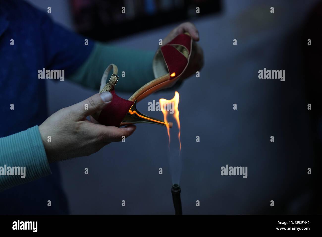 An employee works on crafting tango dance shoes at Necmi Usta's ...