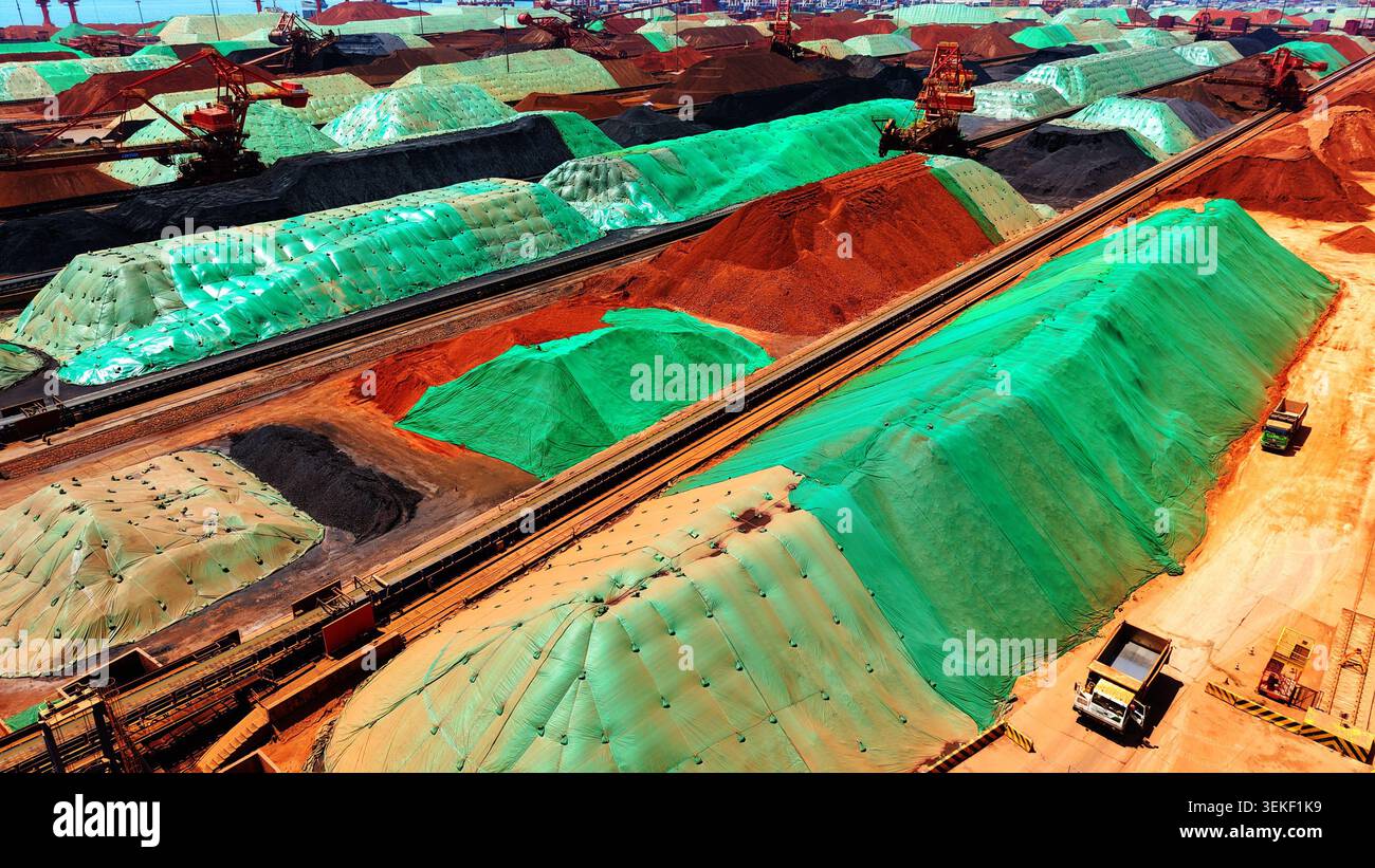 Machinery sorts and transports iron ore at Qingdao Port ore terminal in ...