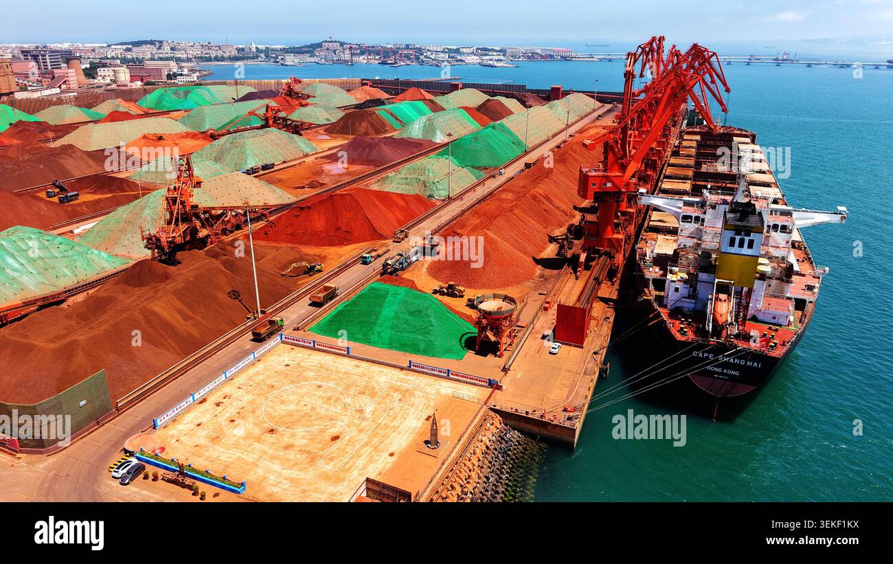 Machinery sorts and transports iron ore at Qingdao Port ore terminal in ...