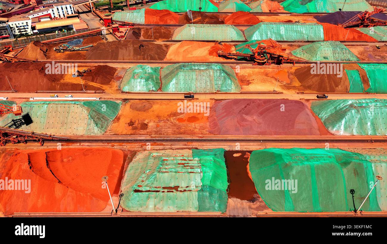 Machinery sorts and transports iron ore at Qingdao Port ore terminal in ...