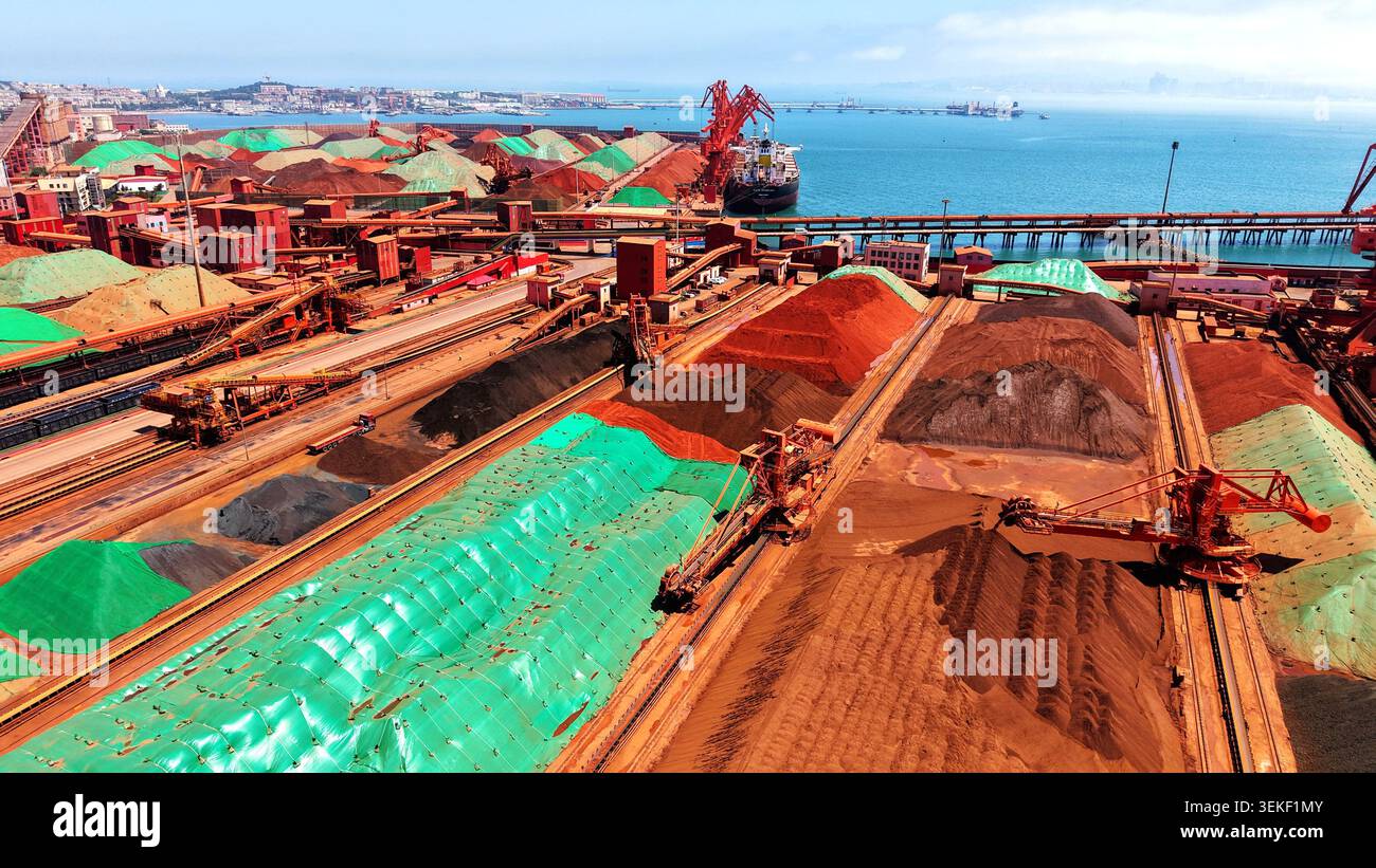 Machinery sorts and transports iron ore at Qingdao Port ore terminal in ...