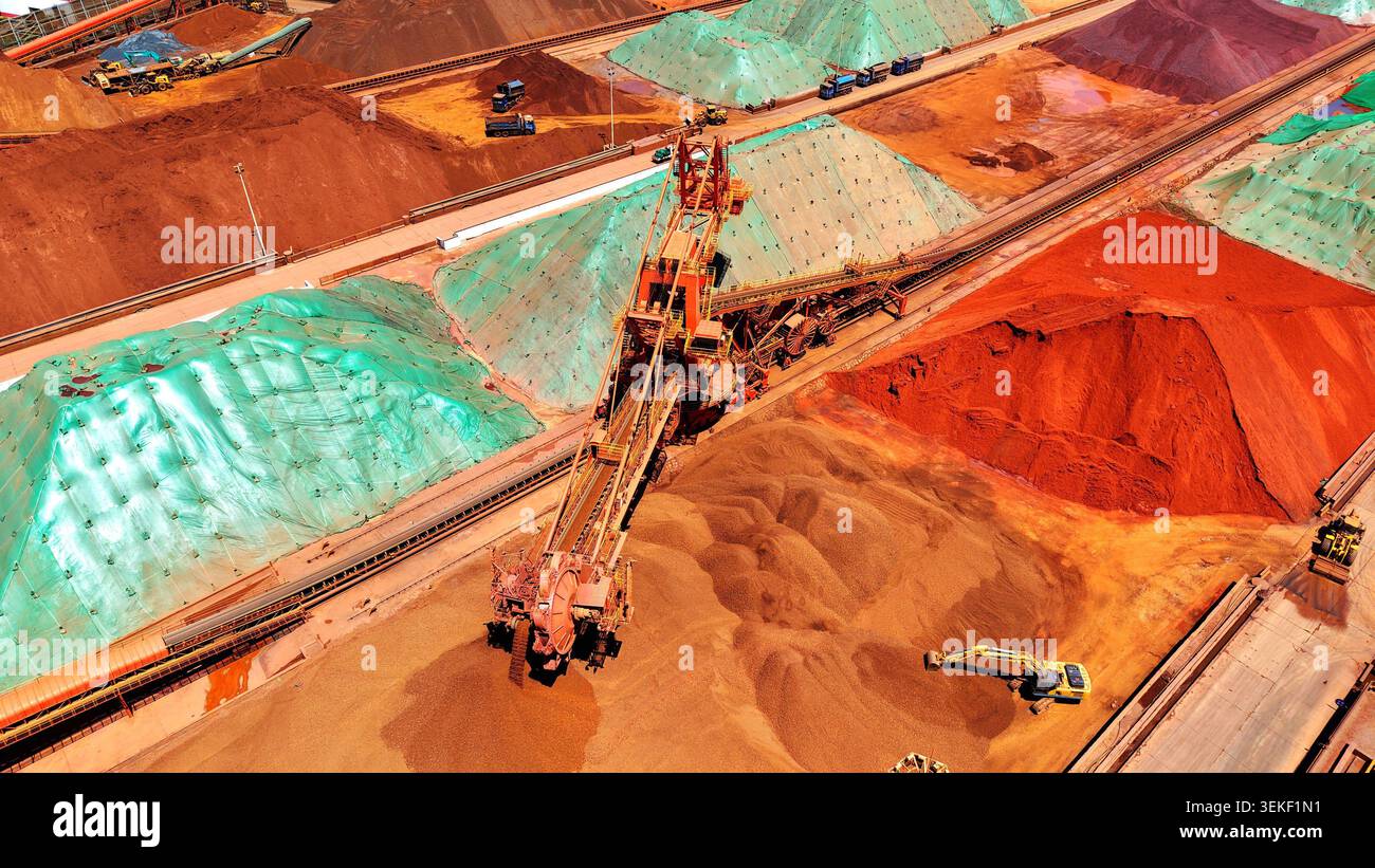 Machinery sorts and transports iron ore at Qingdao Port ore terminal in ...