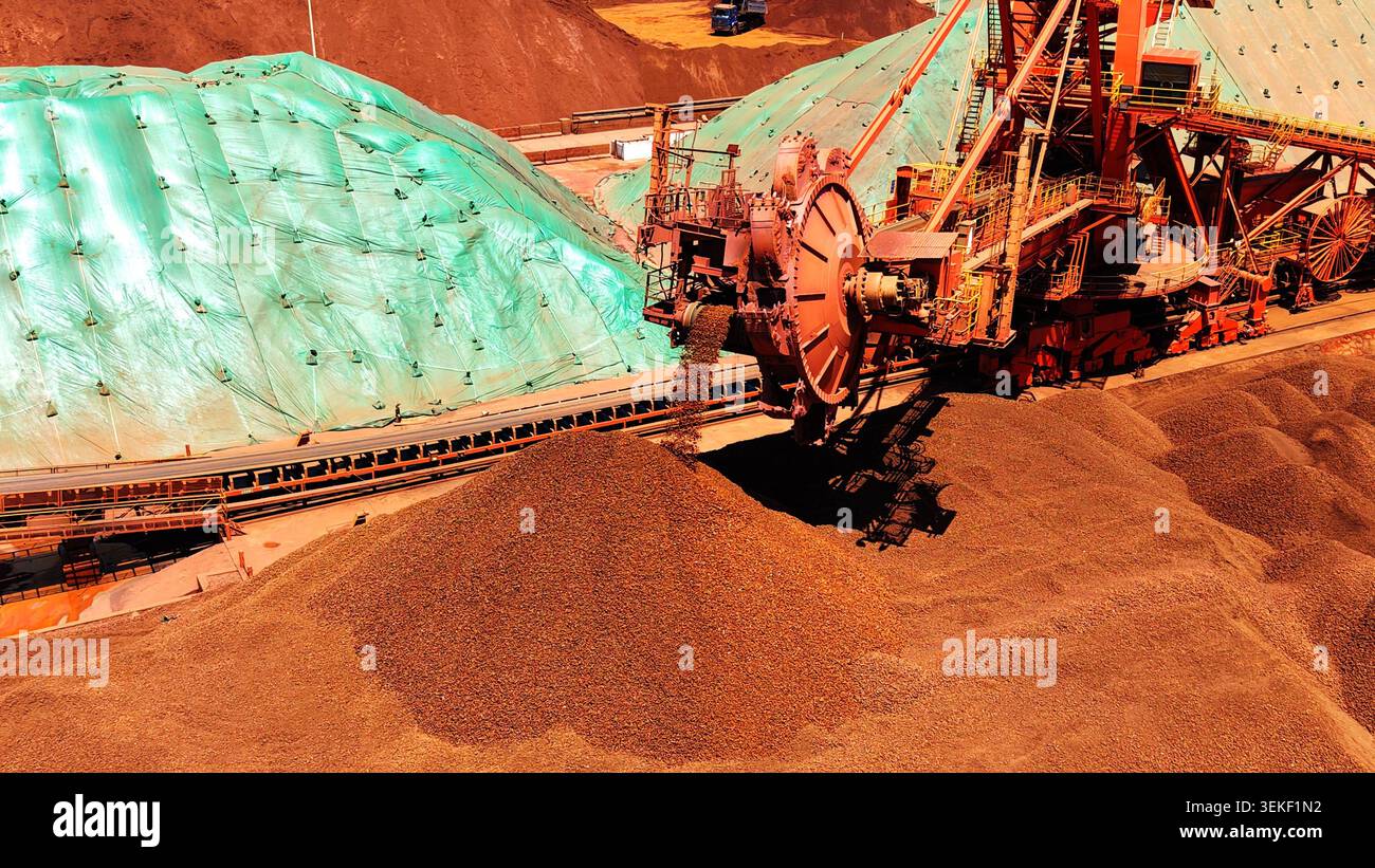 Machinery sorts and transports iron ore at Qingdao Port ore terminal in ...