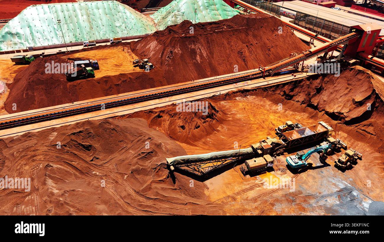 Machinery sorts and transports iron ore at Qingdao Port ore terminal in ...