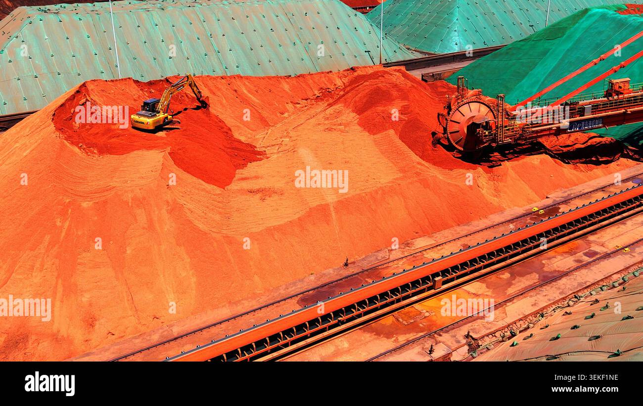 Machinery sorts and transports iron ore at Qingdao Port ore terminal in ...