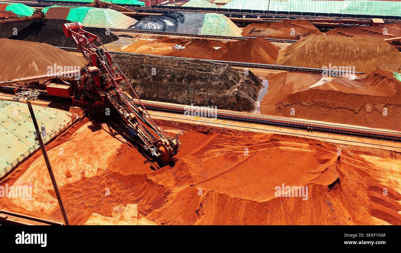 Machinery sorts and transports iron ore at Qingdao Port ore terminal in ...