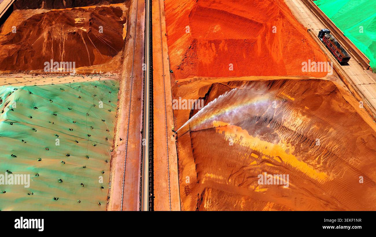 Machinery sorts and transports iron ore at Qingdao Port ore terminal in ...