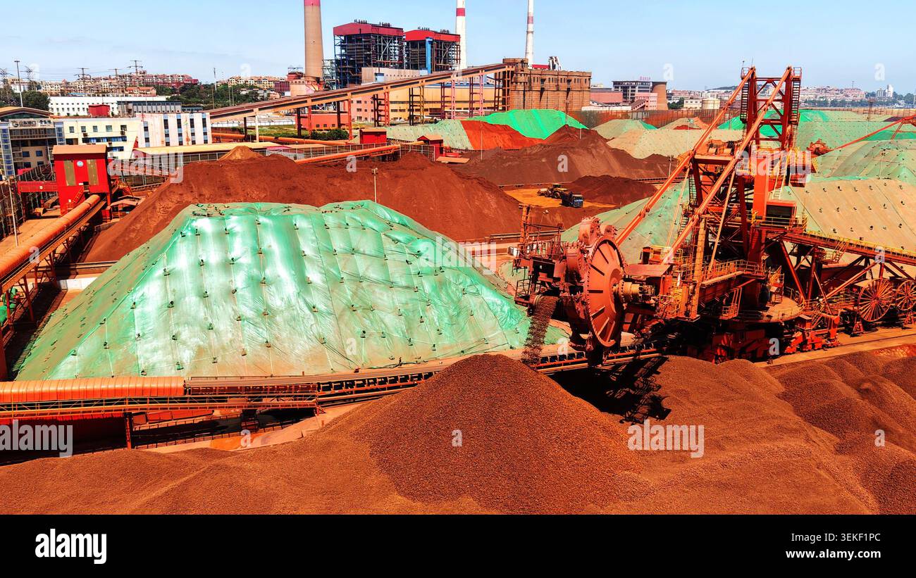Machinery sorts and transports iron ore at Qingdao Port ore terminal in ...