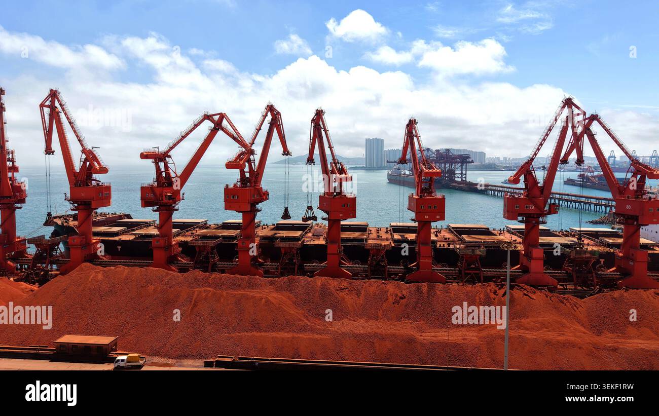 Machinery sorts and transports iron ore at Qingdao Port ore terminal in ...